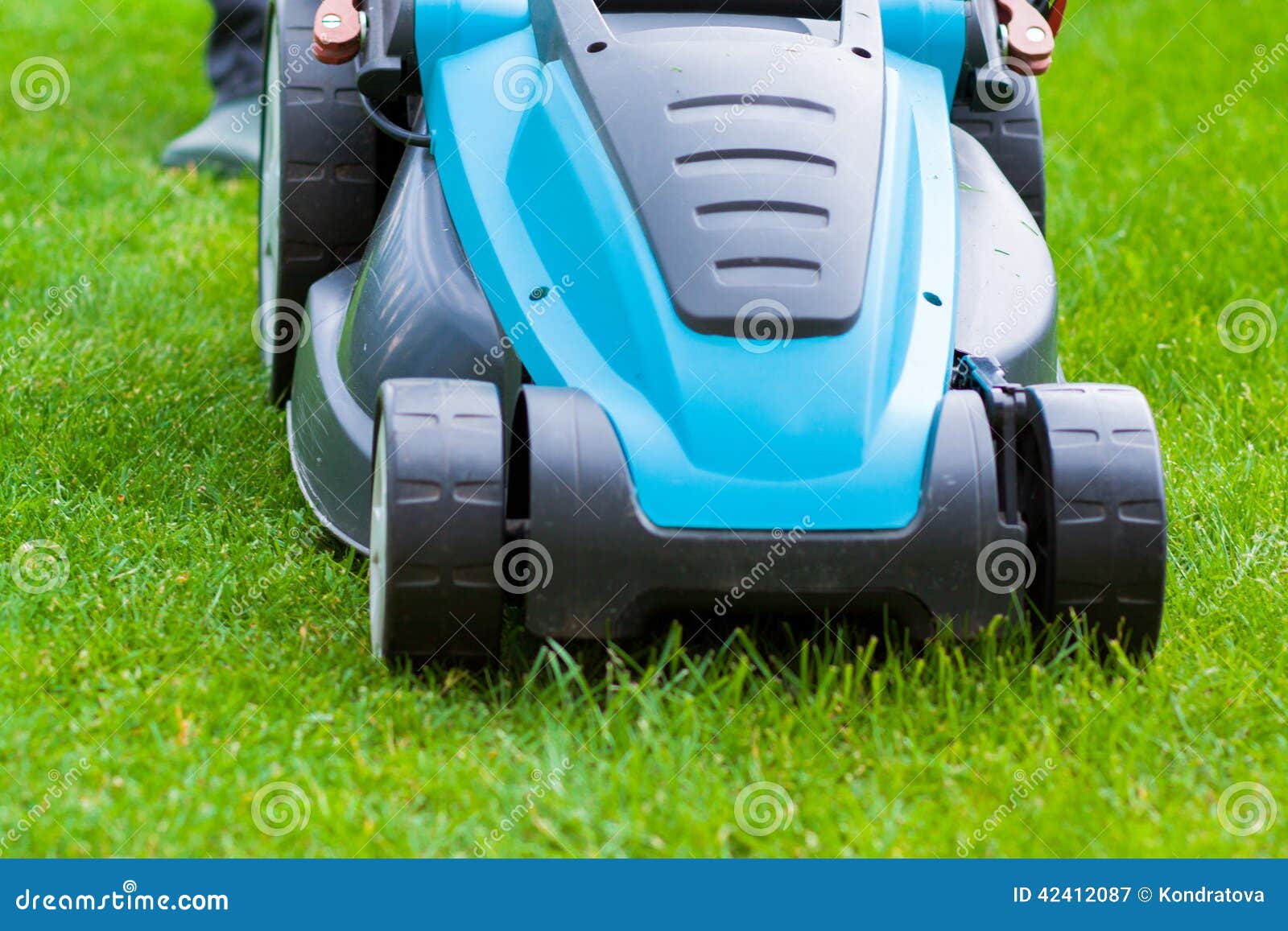 Blue Lawn Mower on Green Grass Cut the Grass Stock Image - Image of ...