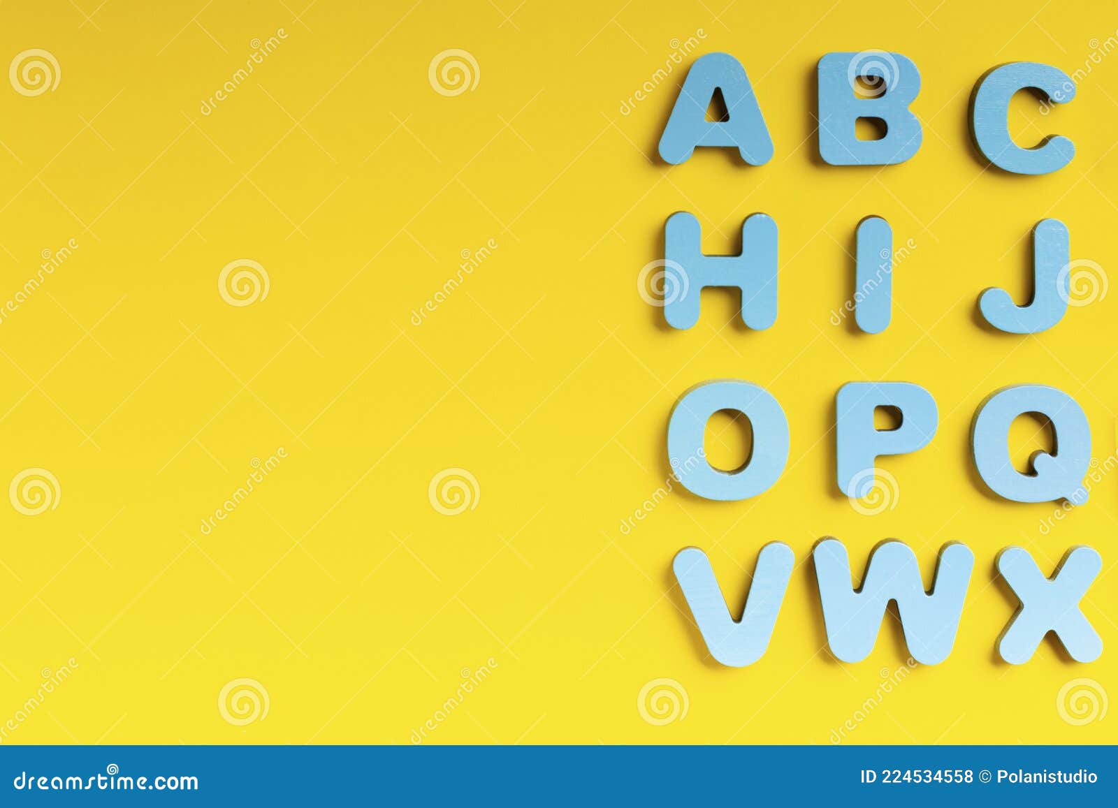 Blue Letters on a Yellow Background Stock Photo - Image of abstract ...