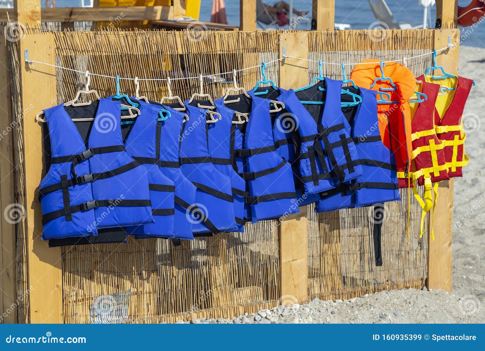 Blue life jackets hanging stock image. Image of save - 160935399