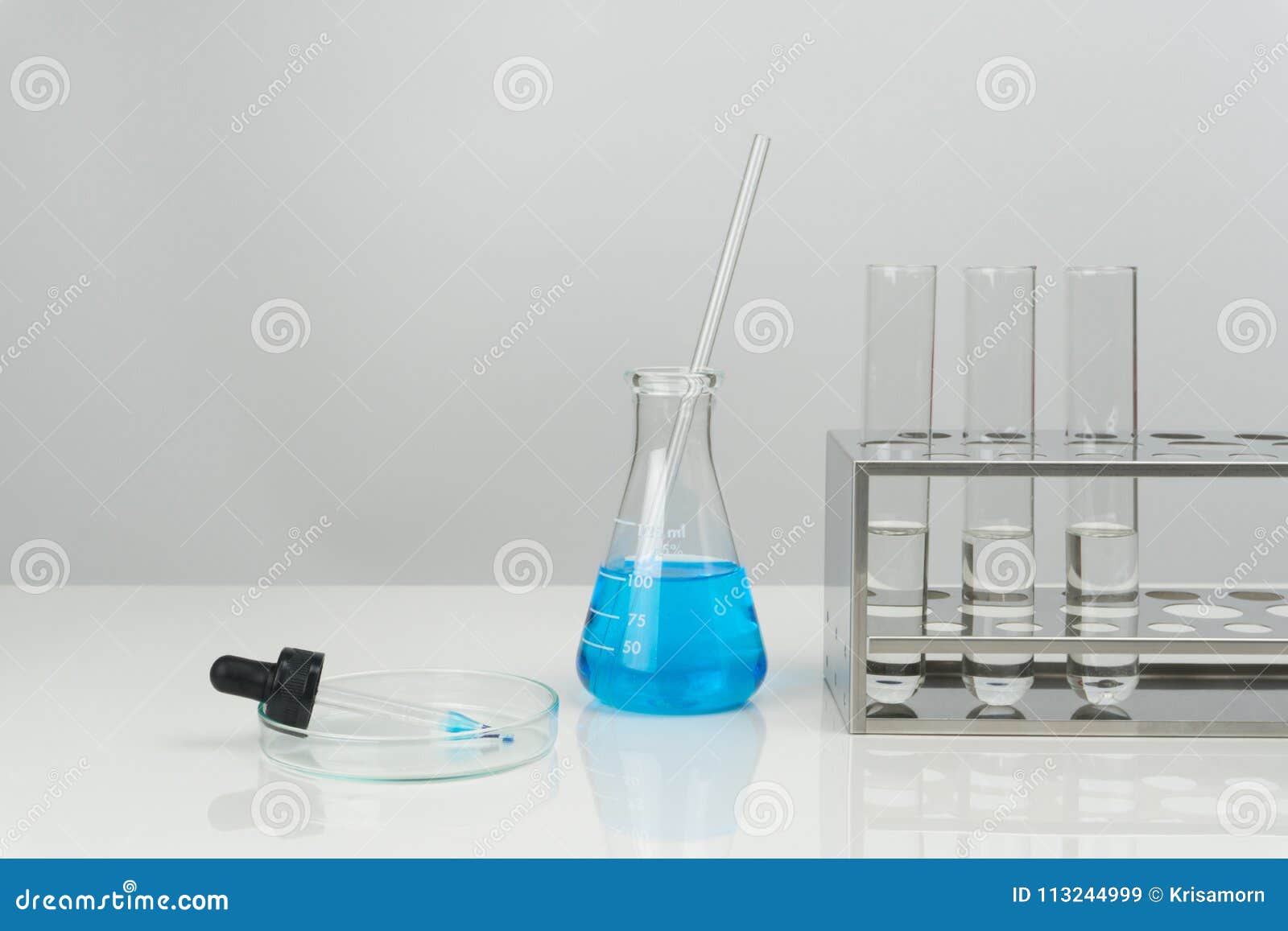 Blue liquid in flask stock image. Image of experiment - 113244999