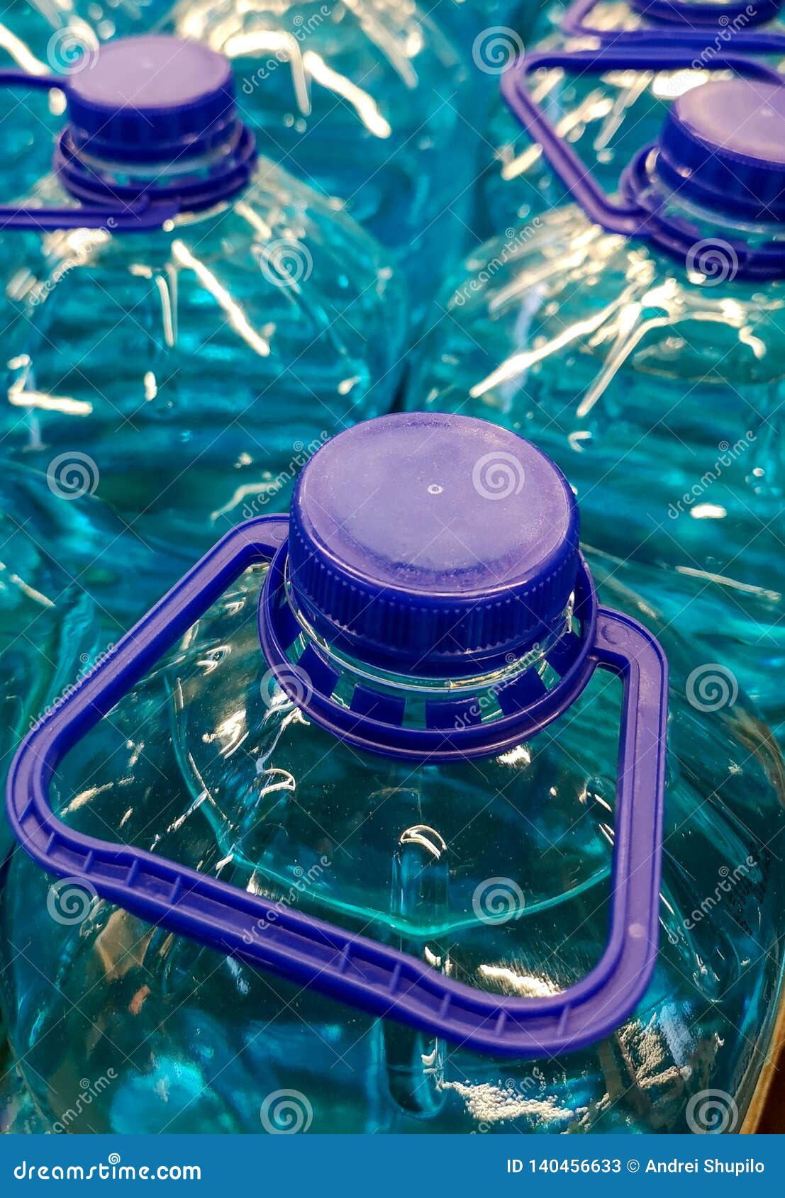 Blue Liquid in Plastic Bottles As a Background Stock Image - Image of ...