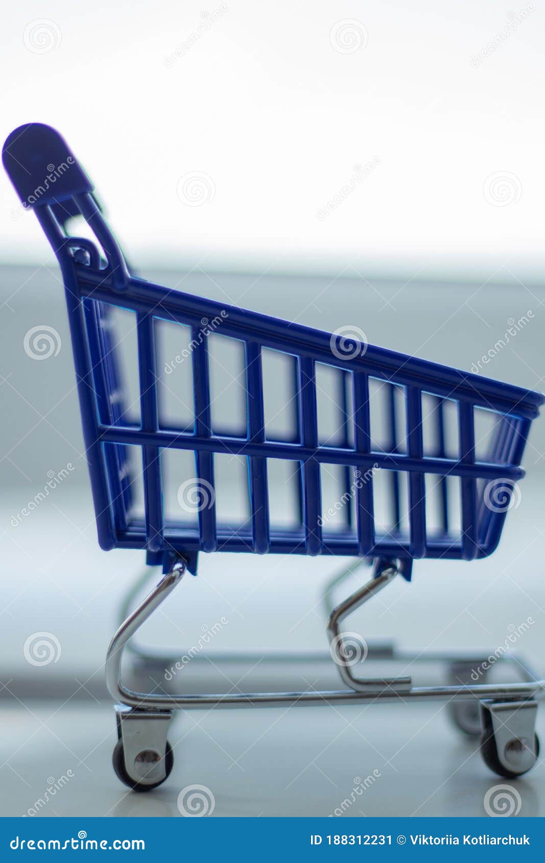 Blue Little Empty Supermarket Trolley for Groceries on a Light ...
