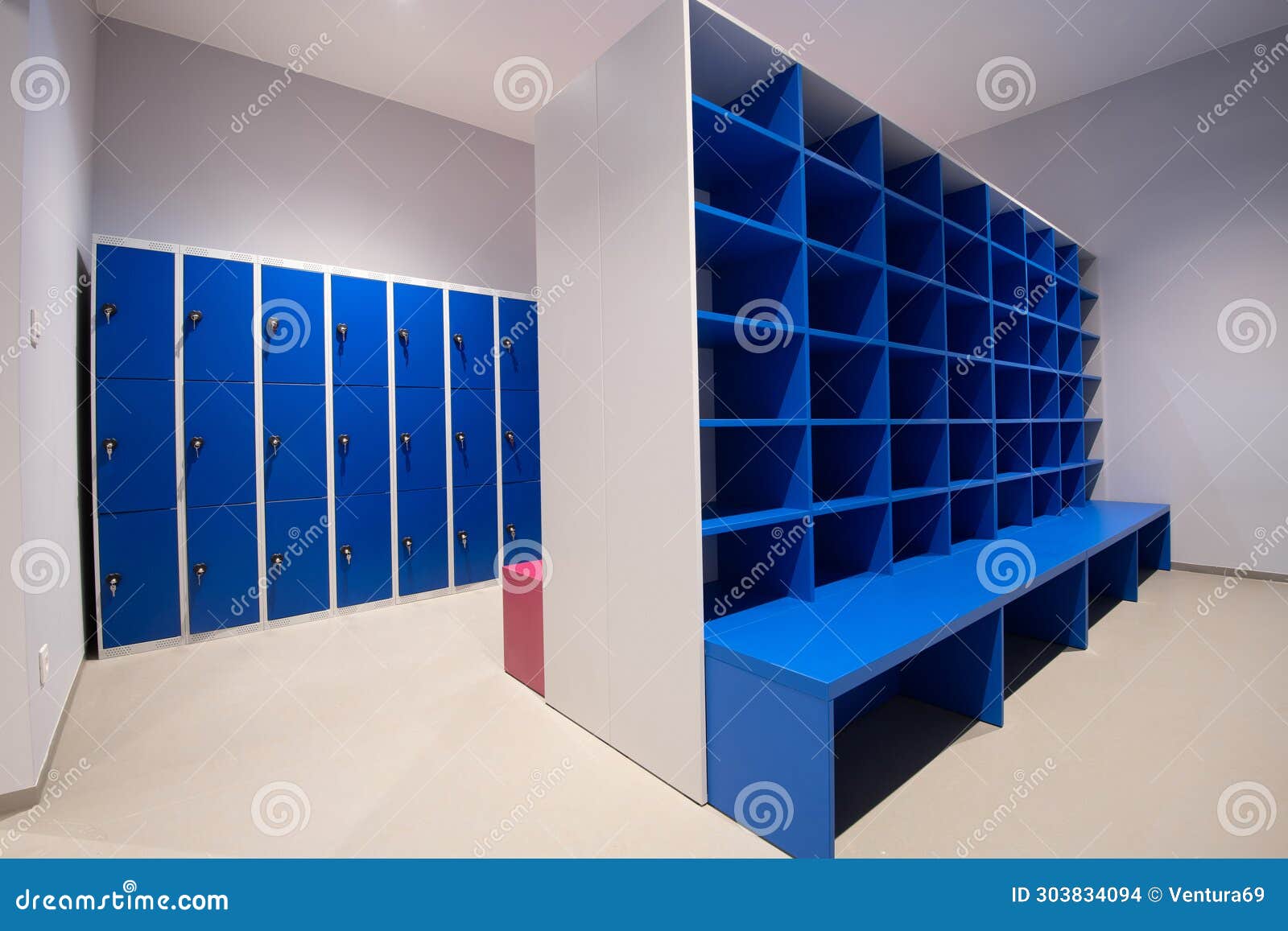 Blue Lockers on a Wall and Cabinet with Empty Shelves with the Bench ...