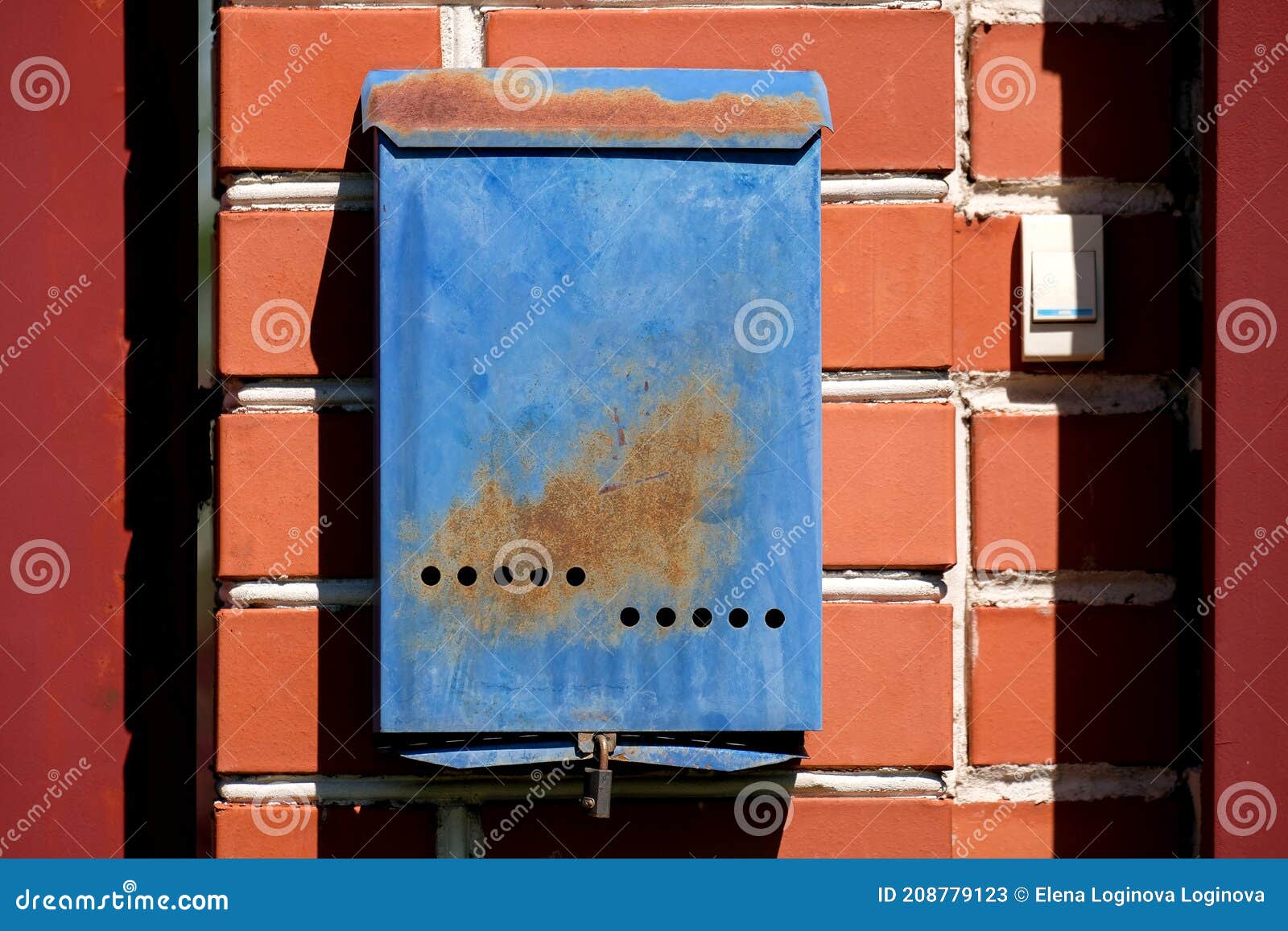 A Blue Mailbox Hangs on a Red Brick Wall Outside. Russian Post Box ...