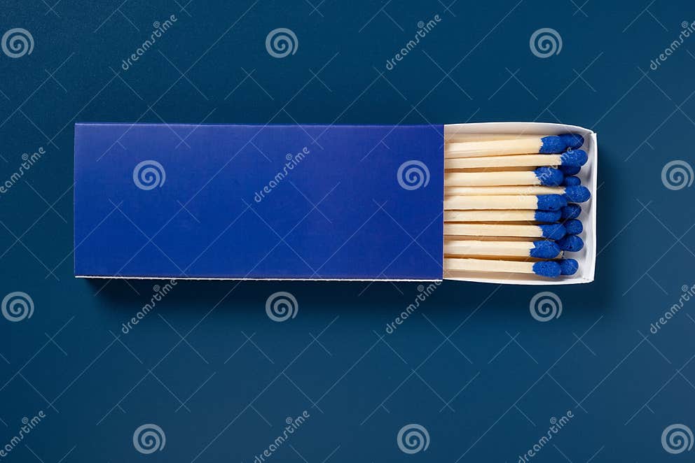 A Blue Matchbox and Blue Match Sticks on a Black Background Stock Image ...