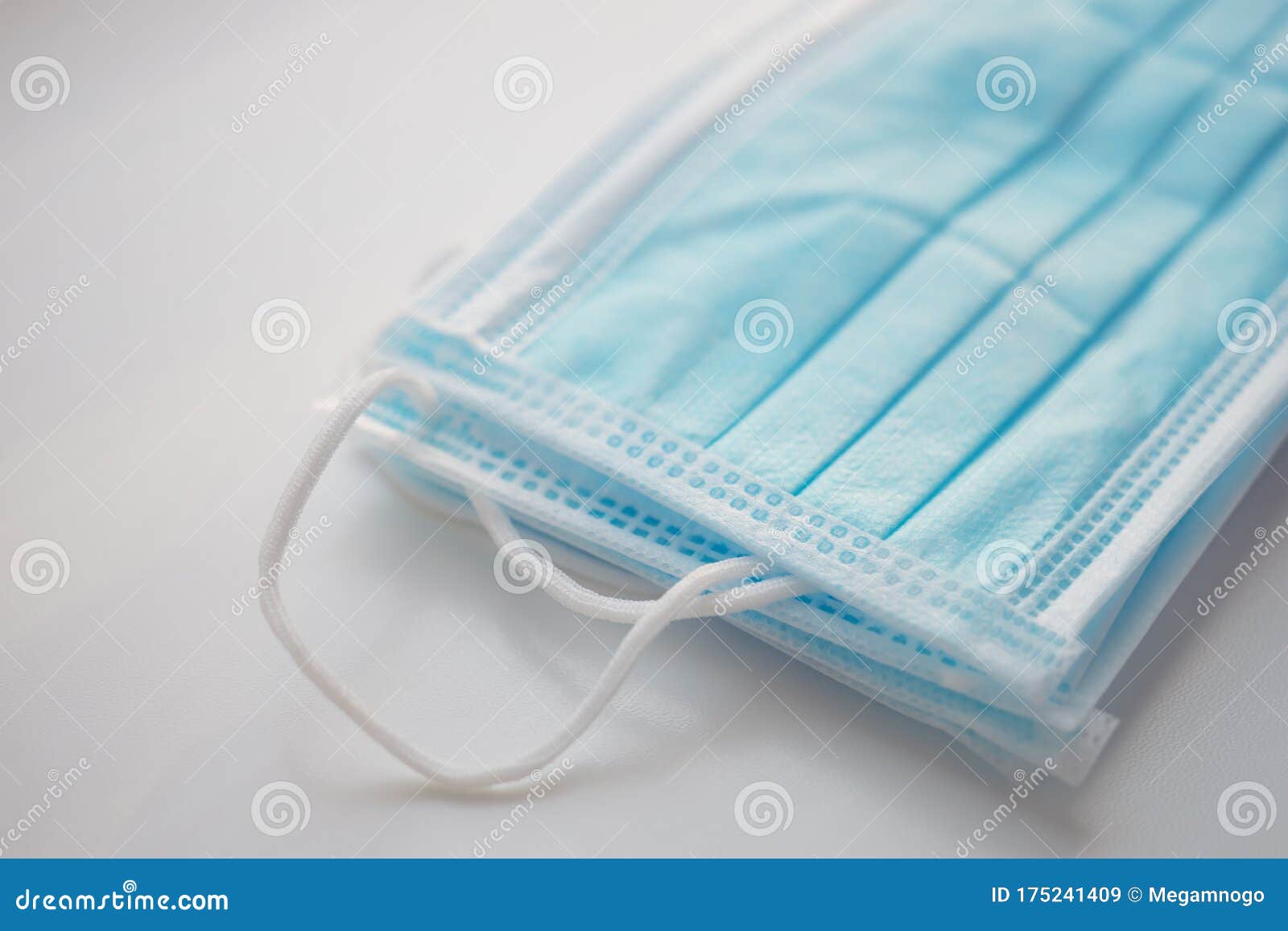 Blue Medical Face Masks on the White Table. Side View Stock Image ...