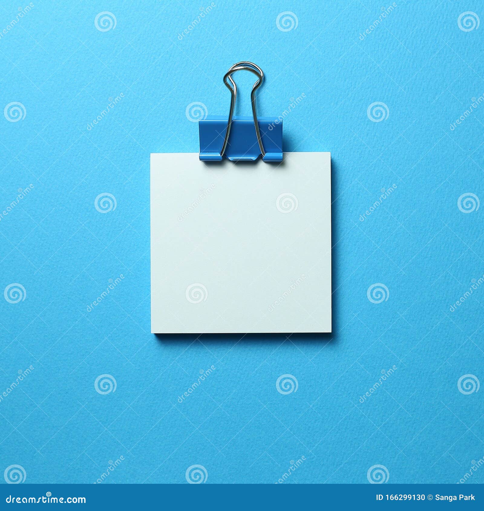 Blue Memo Pad Sticky Note and Clip on Blue Background Stock Photo ...