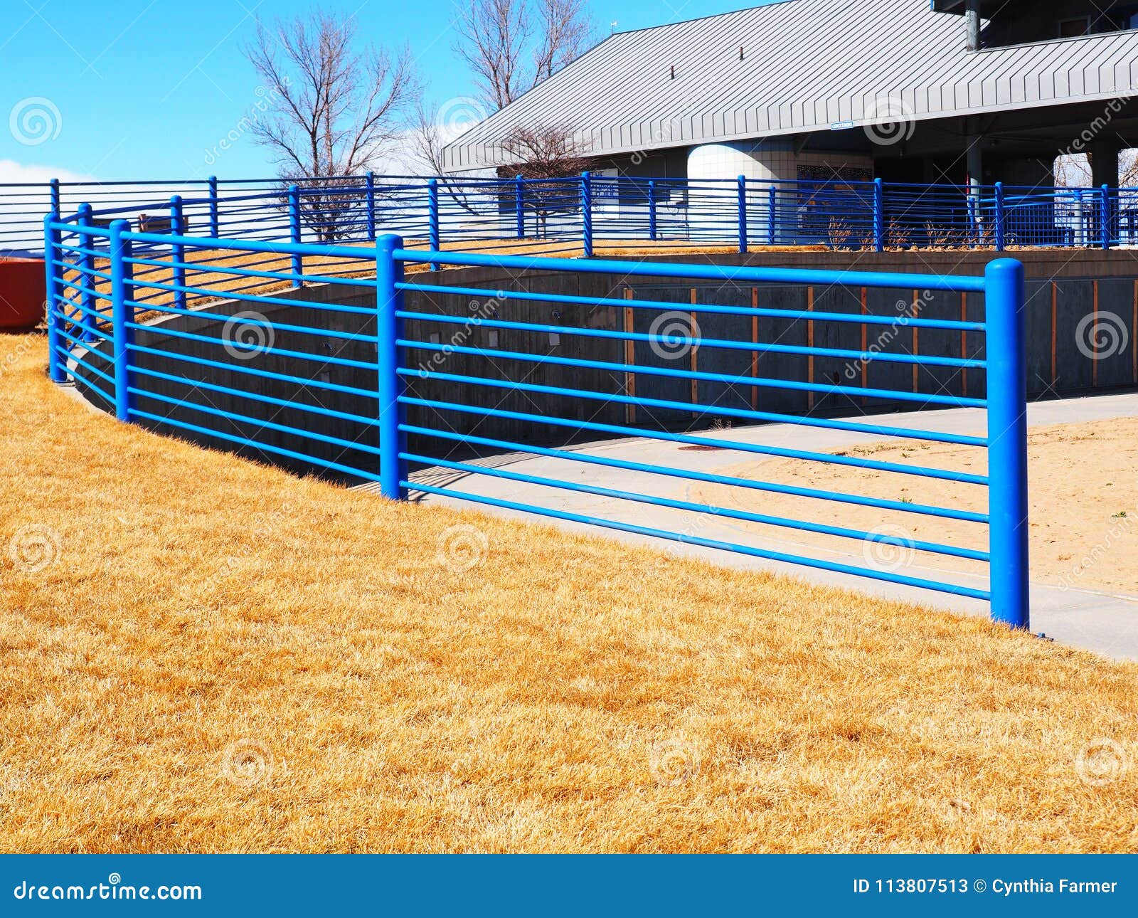 Blue metal fence by grass stock image. Image of fencing - 113807513