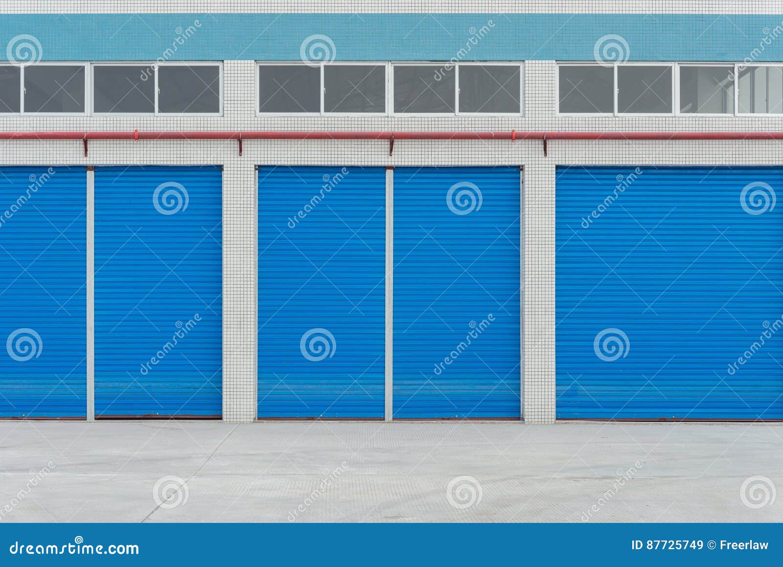 Blue Metal Shutter Doors on Commercial Shop Stock Image - Image of ...