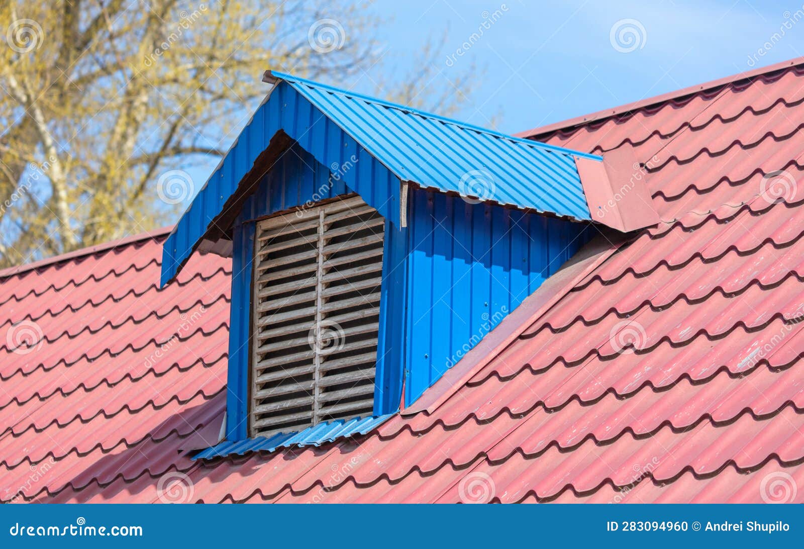 Blue Metal Tile Roof with a Window in the Form of a House Stock Photo ...