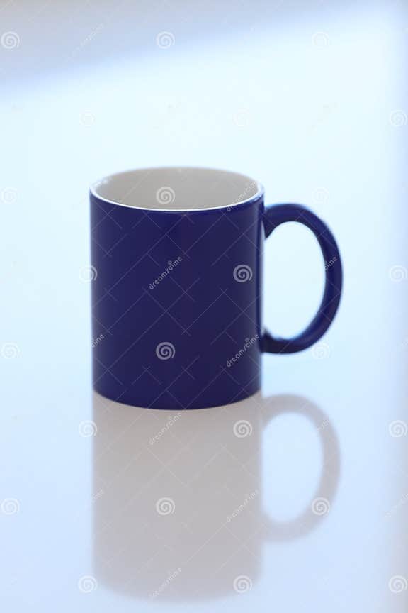 Blue mug with a reflection stock photo. Image of cafe - 212888900