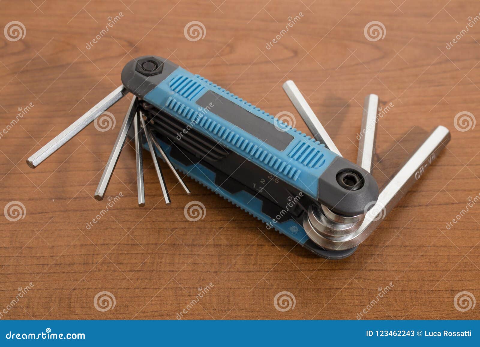 Blue Multitool Allen Keys on a Wood Table Stock Image - Image of tools ...