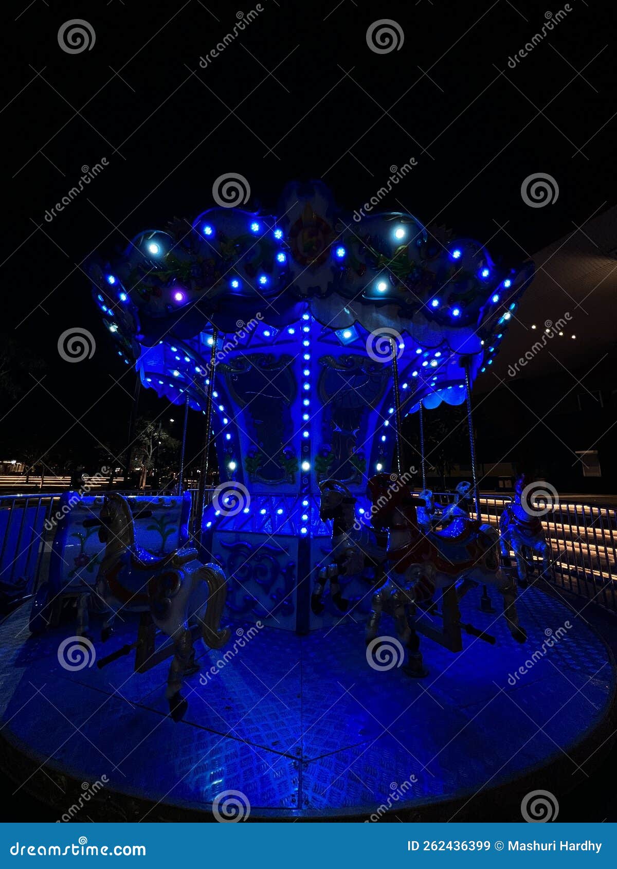 A blue neon carousel stock image. Image of waiting, scene - 262436399