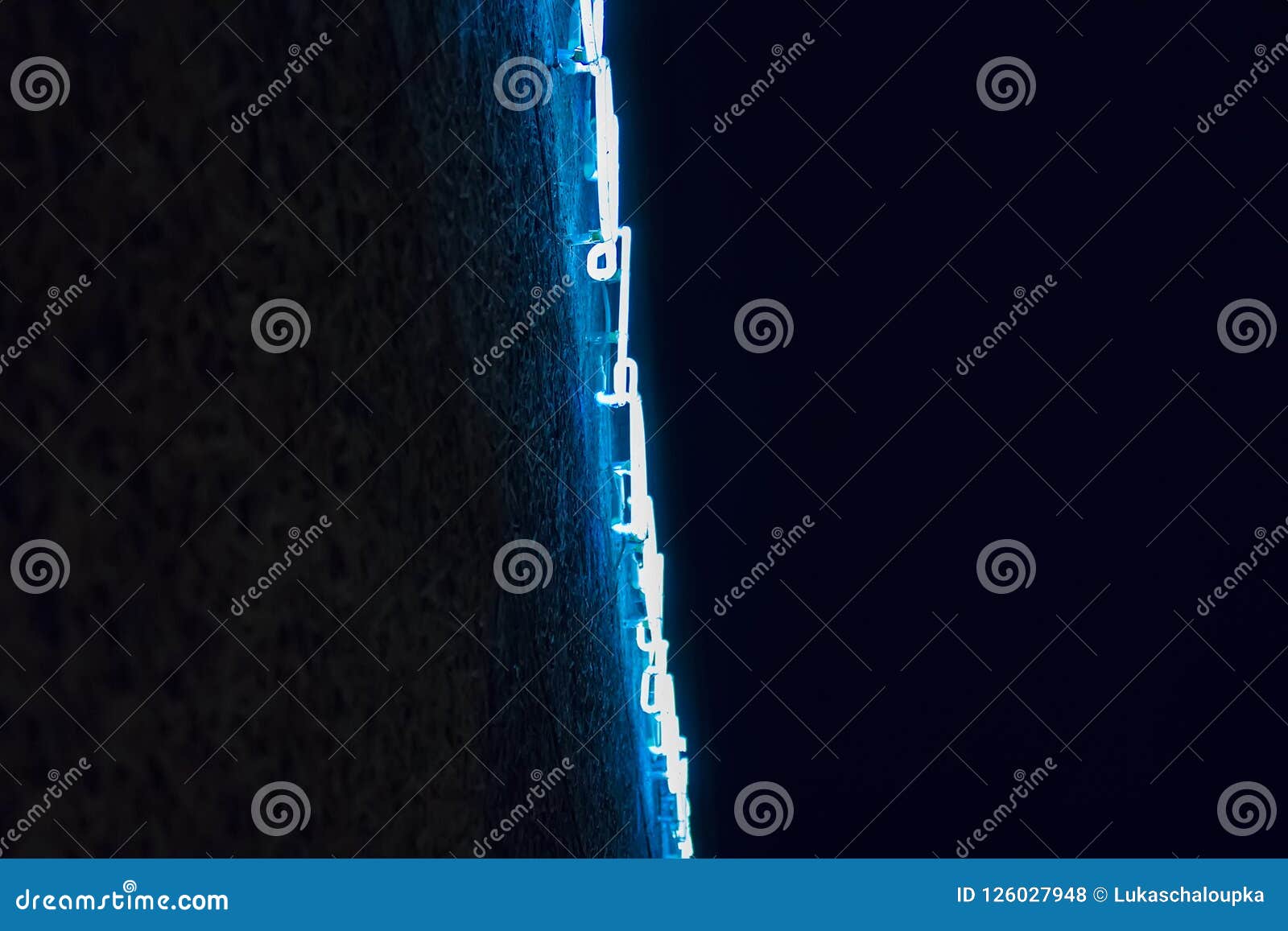 Blue Neon Light on Dark Texture Wall from Bottom Stock Photo - Image of ...