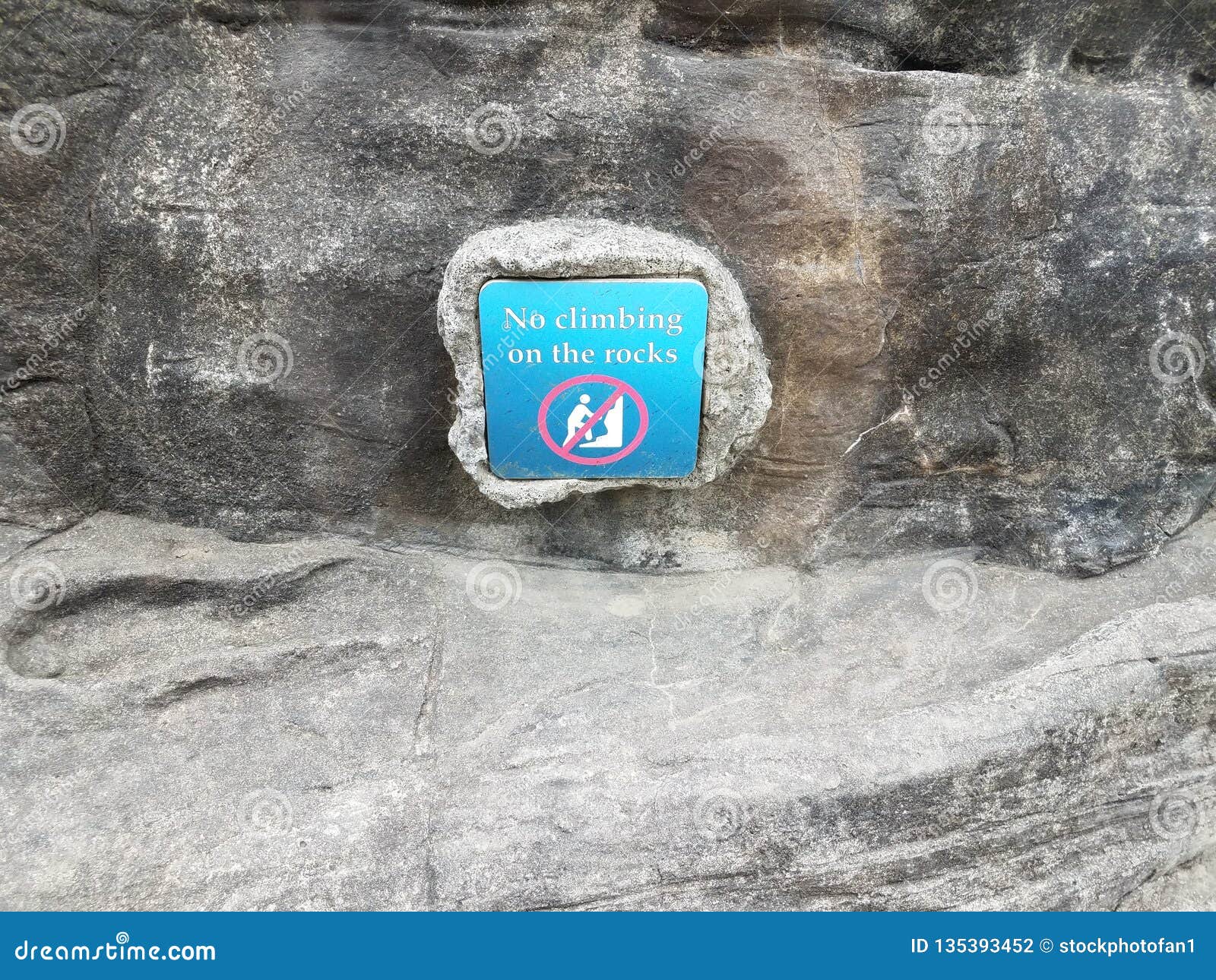 Blue No Climbing on the Rocks Sign with Grey Rock Stock Photo - Image ...
