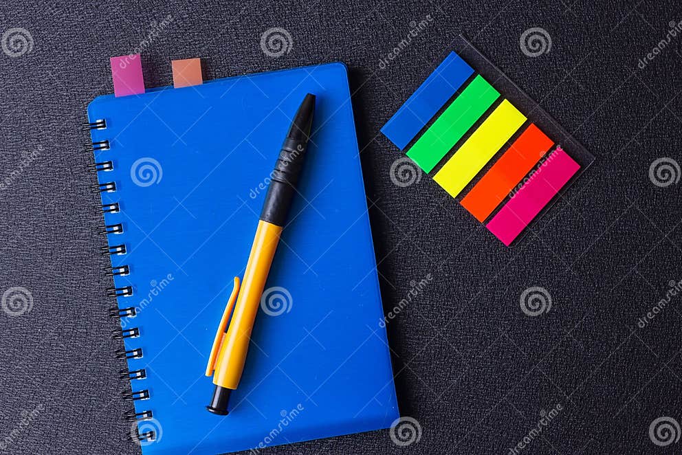 Blue Notepad with Multi-colored Stickers and Pen Stock Photo - Image of ...