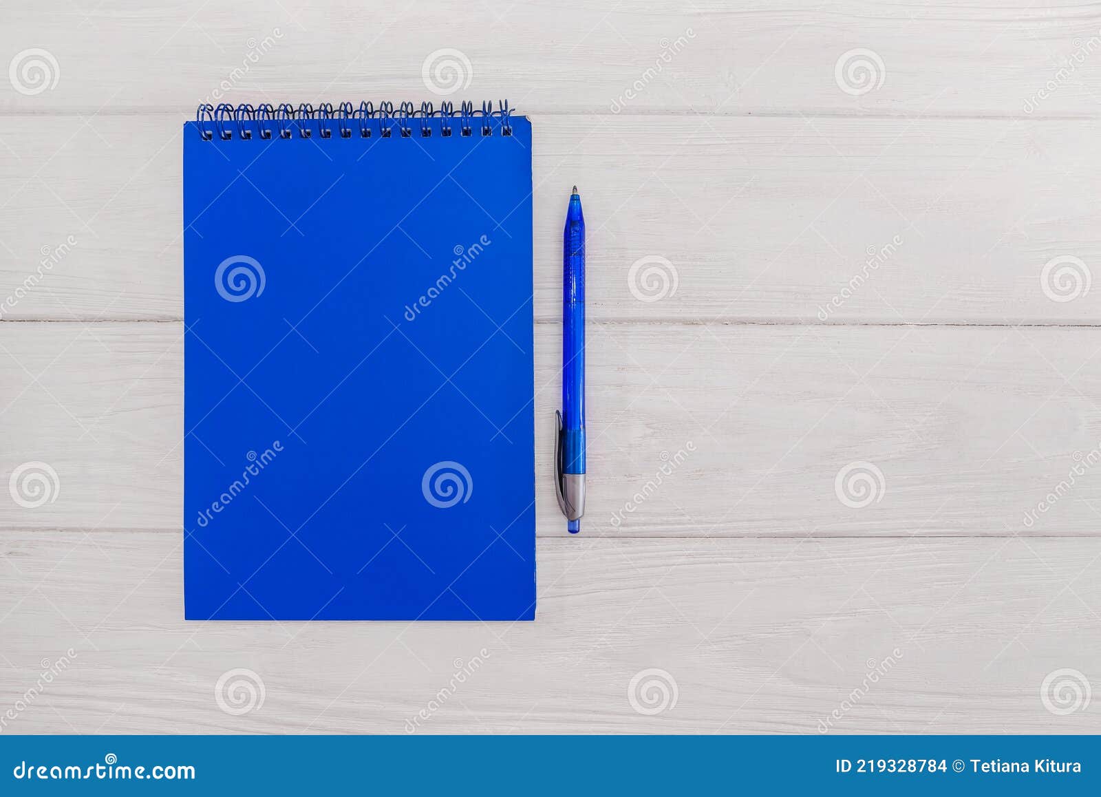 Blue Notepad and Blue Pen on a White Wooden Background. Copy Space ...