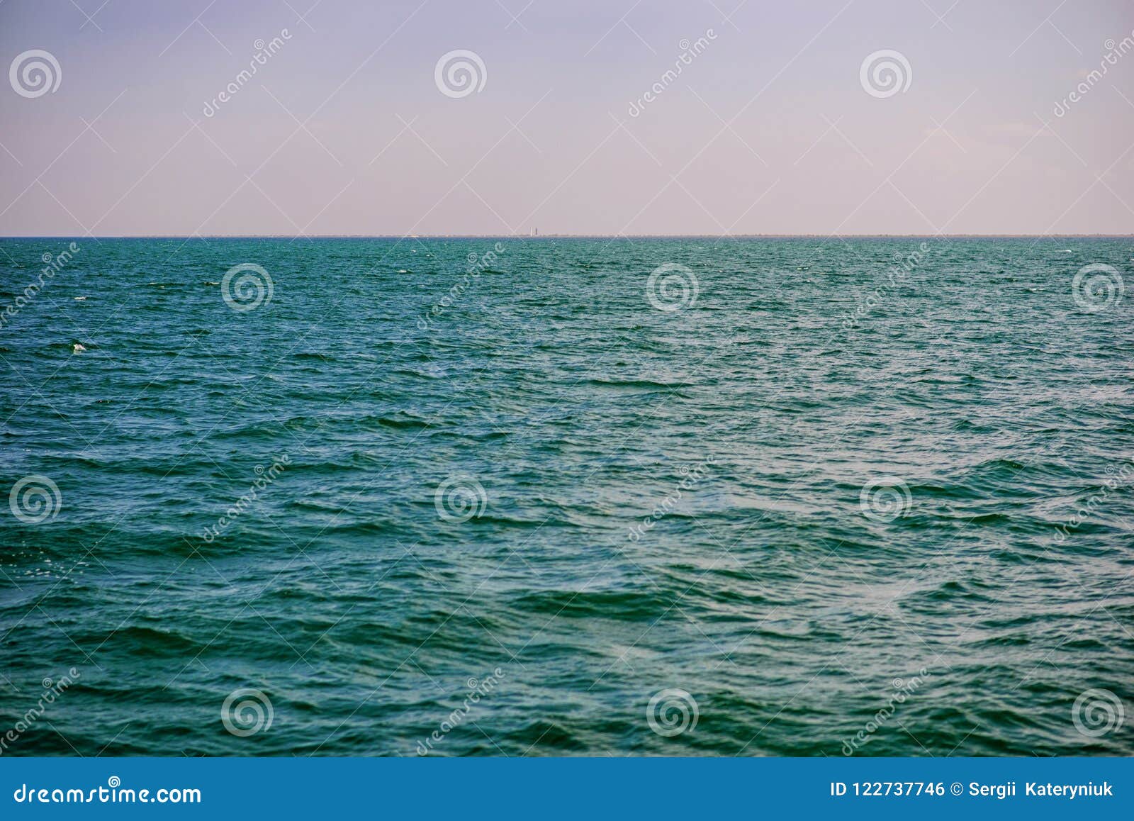The Blue Ocean with Dull Clouds on a Lovely Sunny Day Stock Photo ...