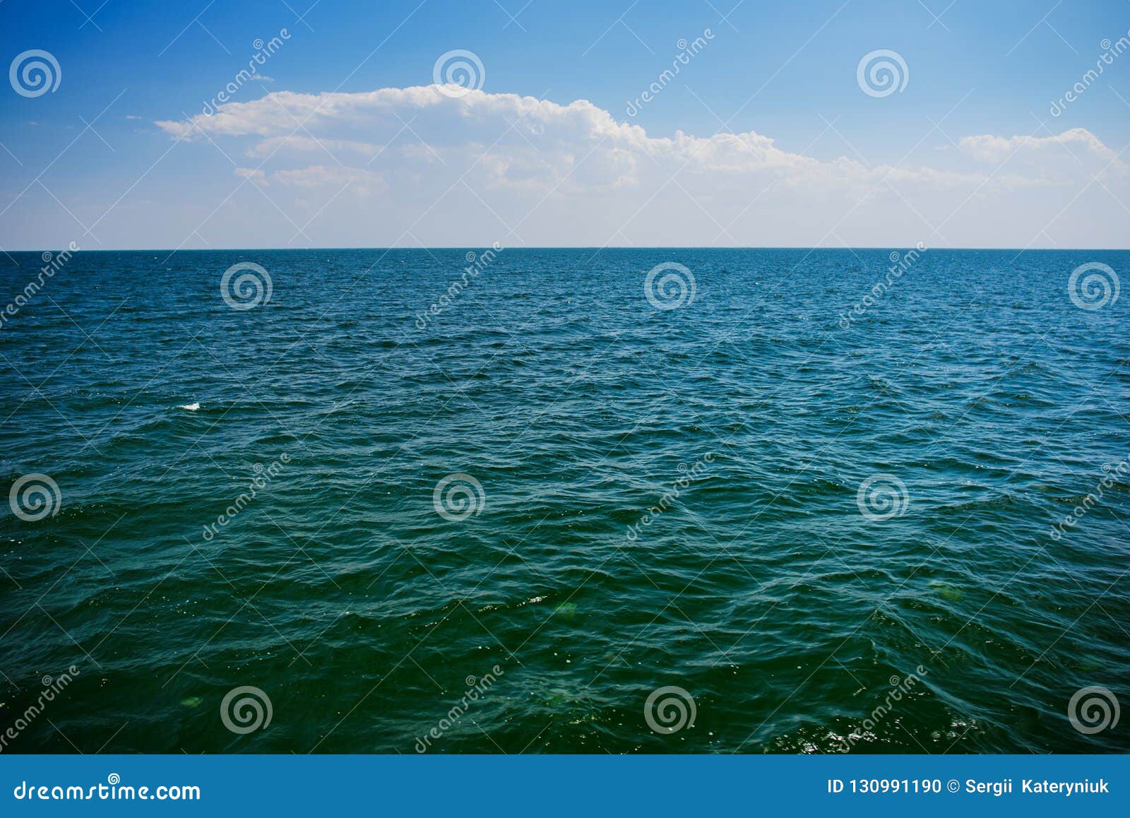 The Blue Ocean with Dull Clouds on a Lovely Sunny Day Stock Photo ...