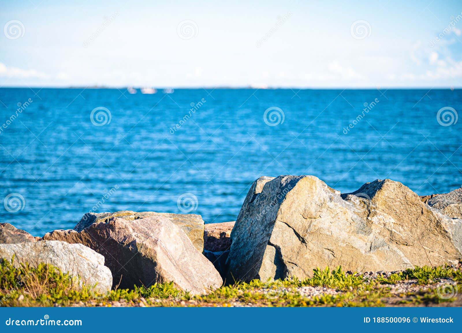 Blue Ocean Seen from the Rocks on the Beach Stock Photo - Image of ...