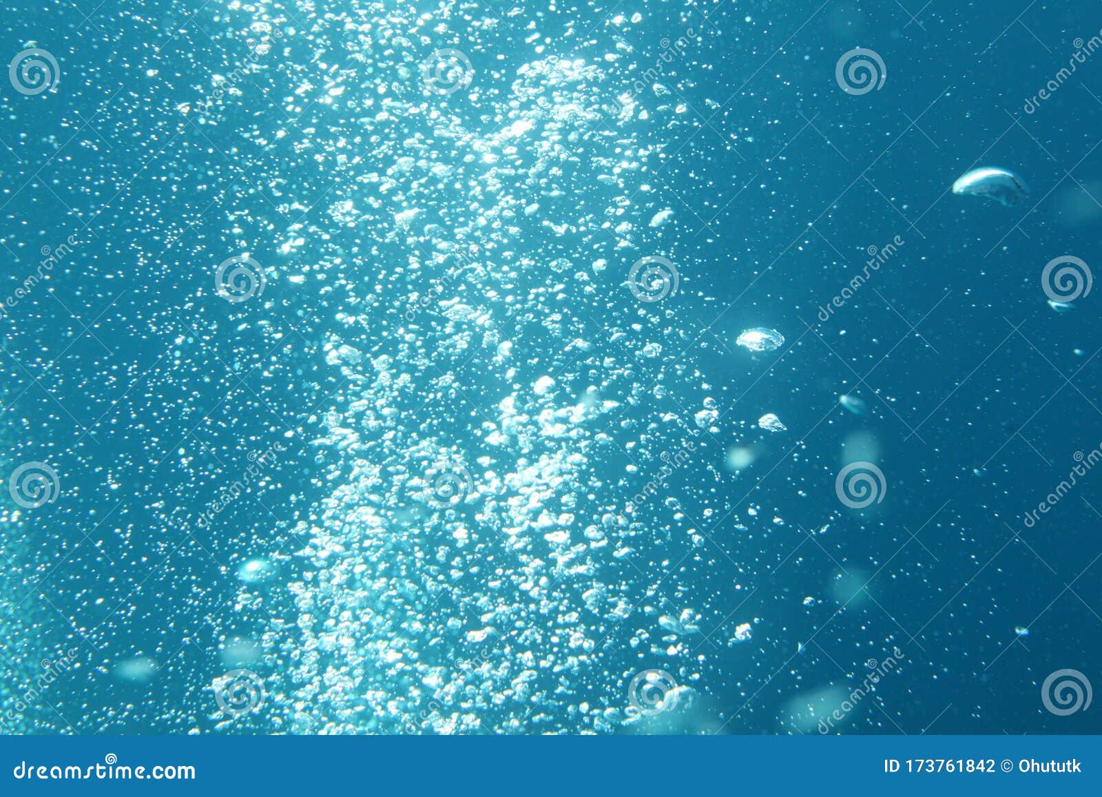 Blue Ocean Waves from Underwater with Bubbles. Light Rays Shining ...