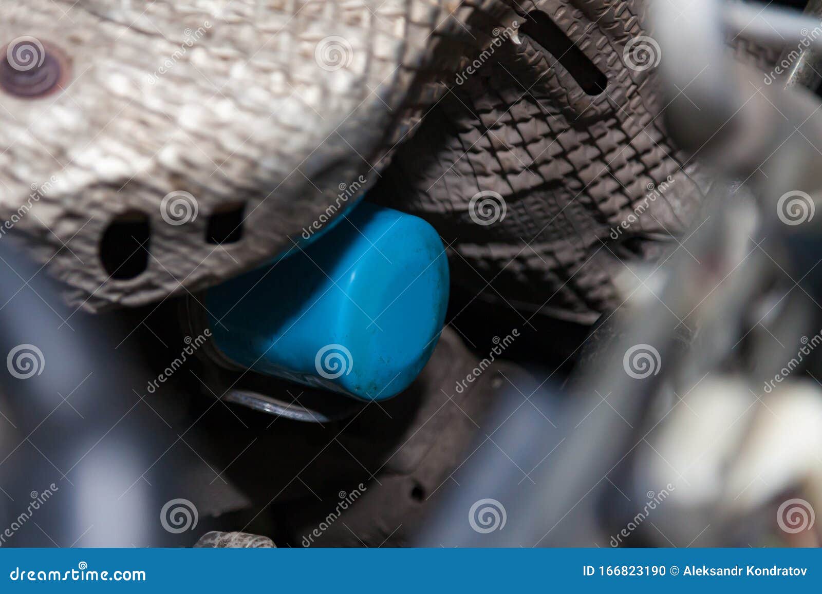 Blue Oil Filter for a Car Engine in the Engine Compartment of a Car ...