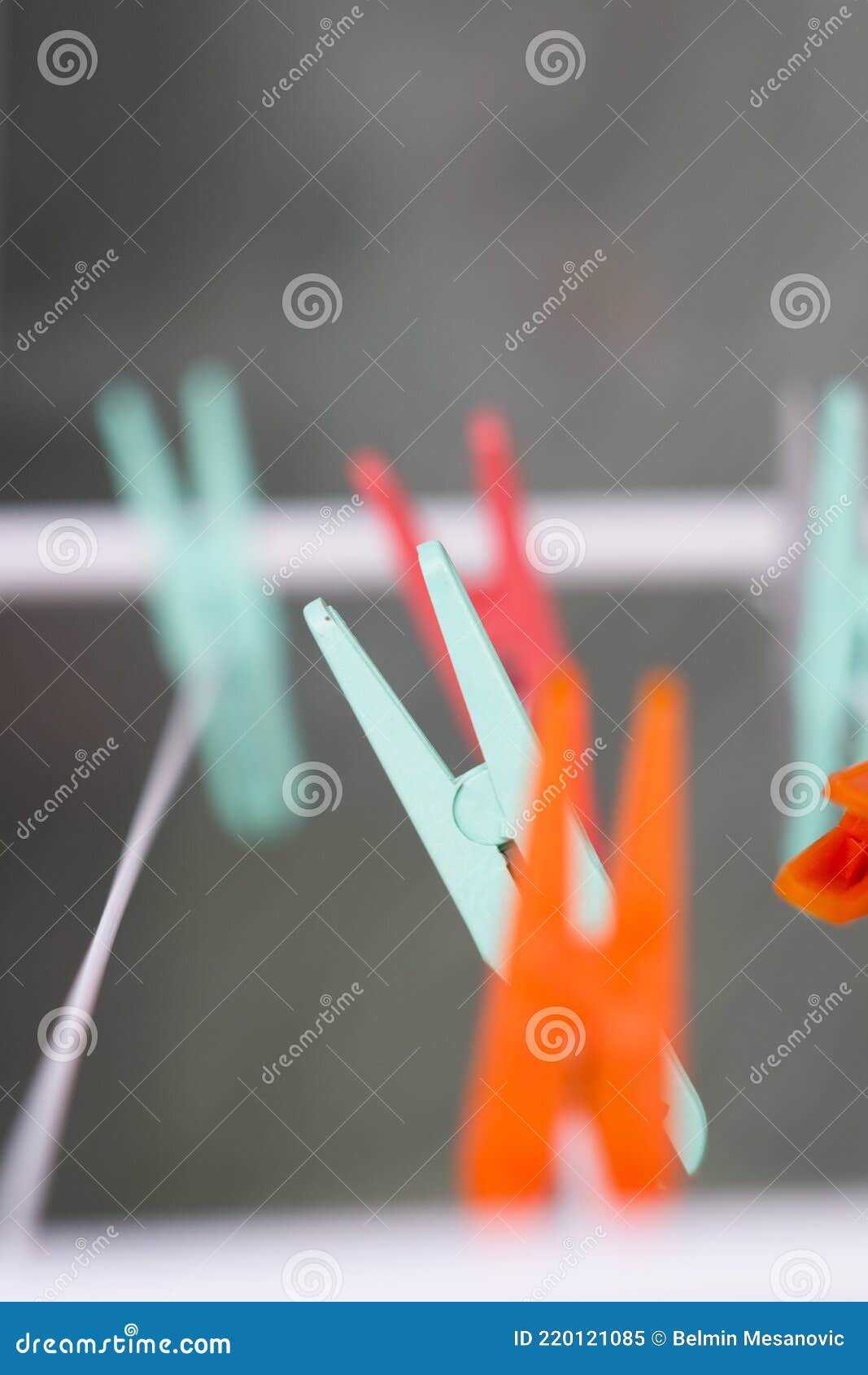 Blue and Orange Clothes Pegs Stock Image - Image of green, white: 220121085