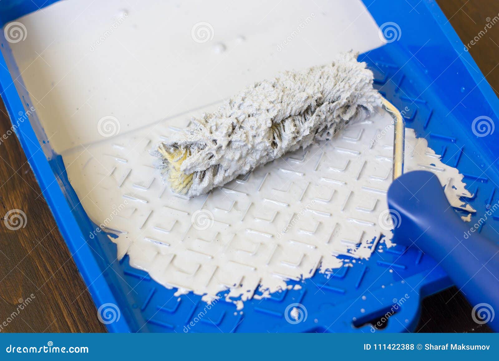 Blue Paint Tray with Paint Roller and Paint Inside it. Stock Photo ...