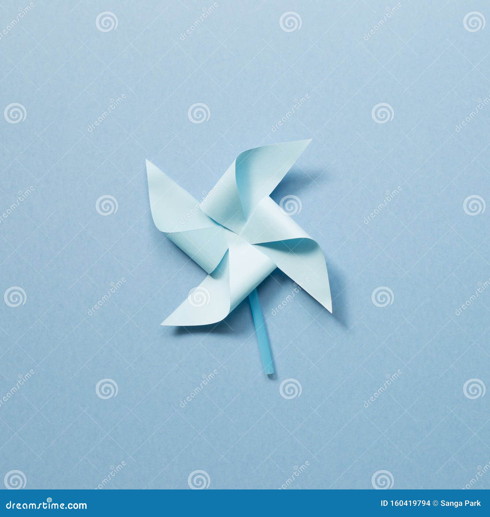 Blue Paper Pinwheel on Blue Background Stock Photo - Image of shot ...