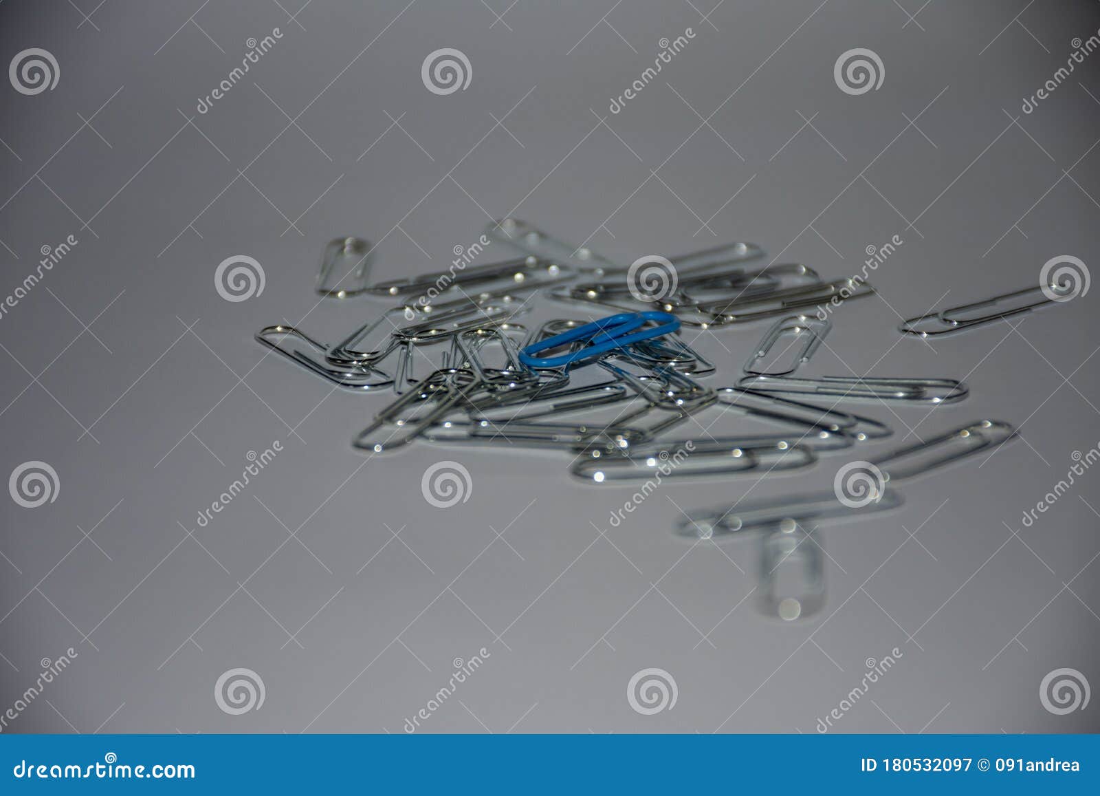 Blue Paperclip Different from Others Stock Image - Image of isolated ...