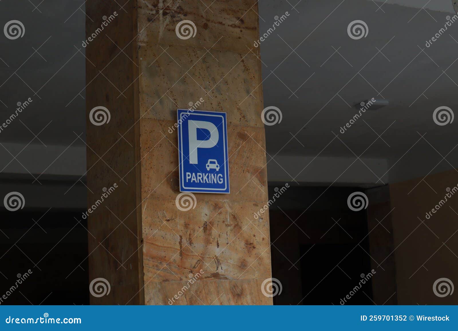 Blue Parking Sign on Column Stock Photo - Image of building, sign ...