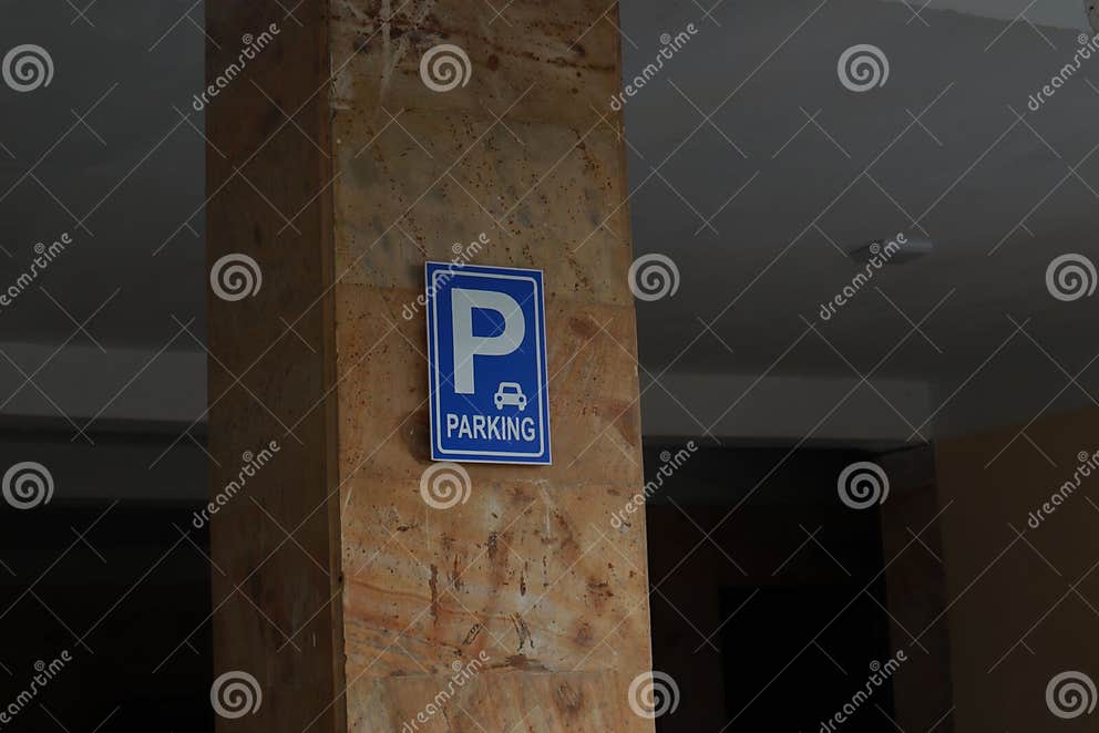 Blue Parking Sign on Column Stock Photo - Image of building, sign ...