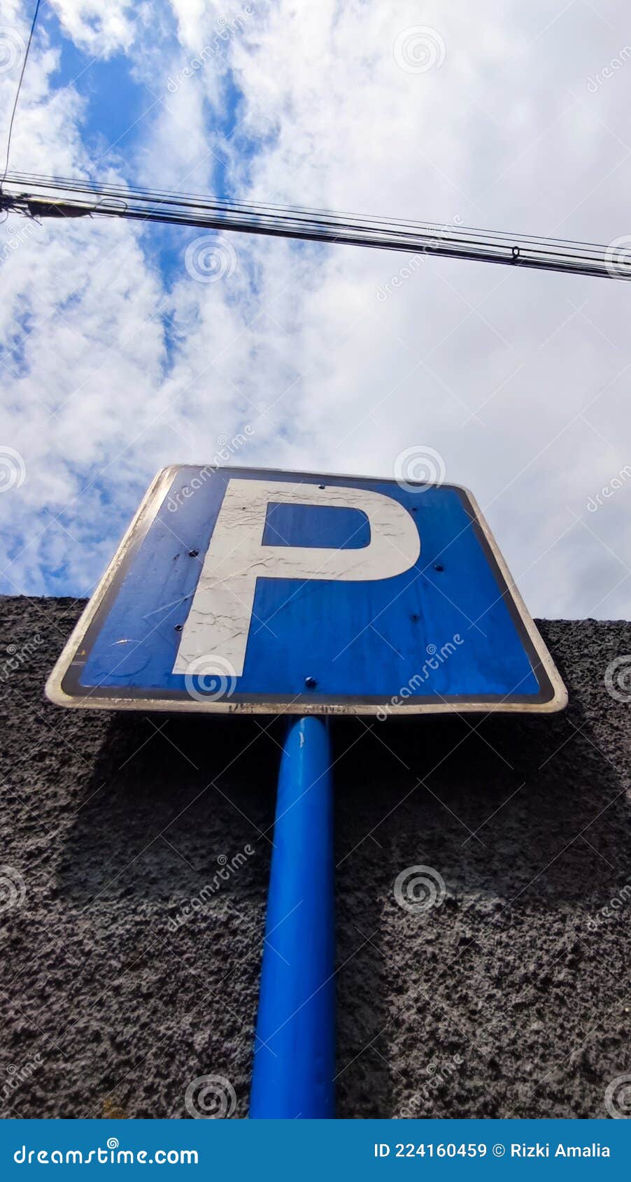 Blue Parking Sign and Blue Sky Stock Image - Image of sign, blue: 224160459