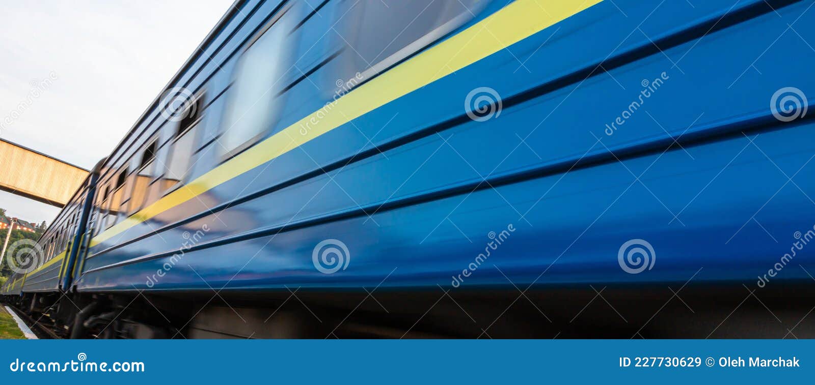 A Blue Passenger Train Travels Along Stock Image - Image of equipment ...