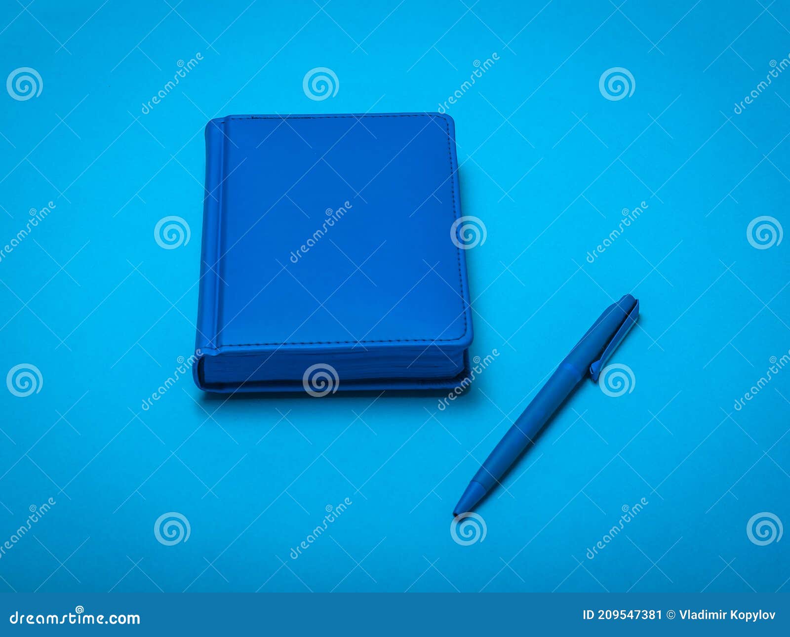 Blue Pen and Blue Notepad on a Blue Background Stock Image - Image of ...