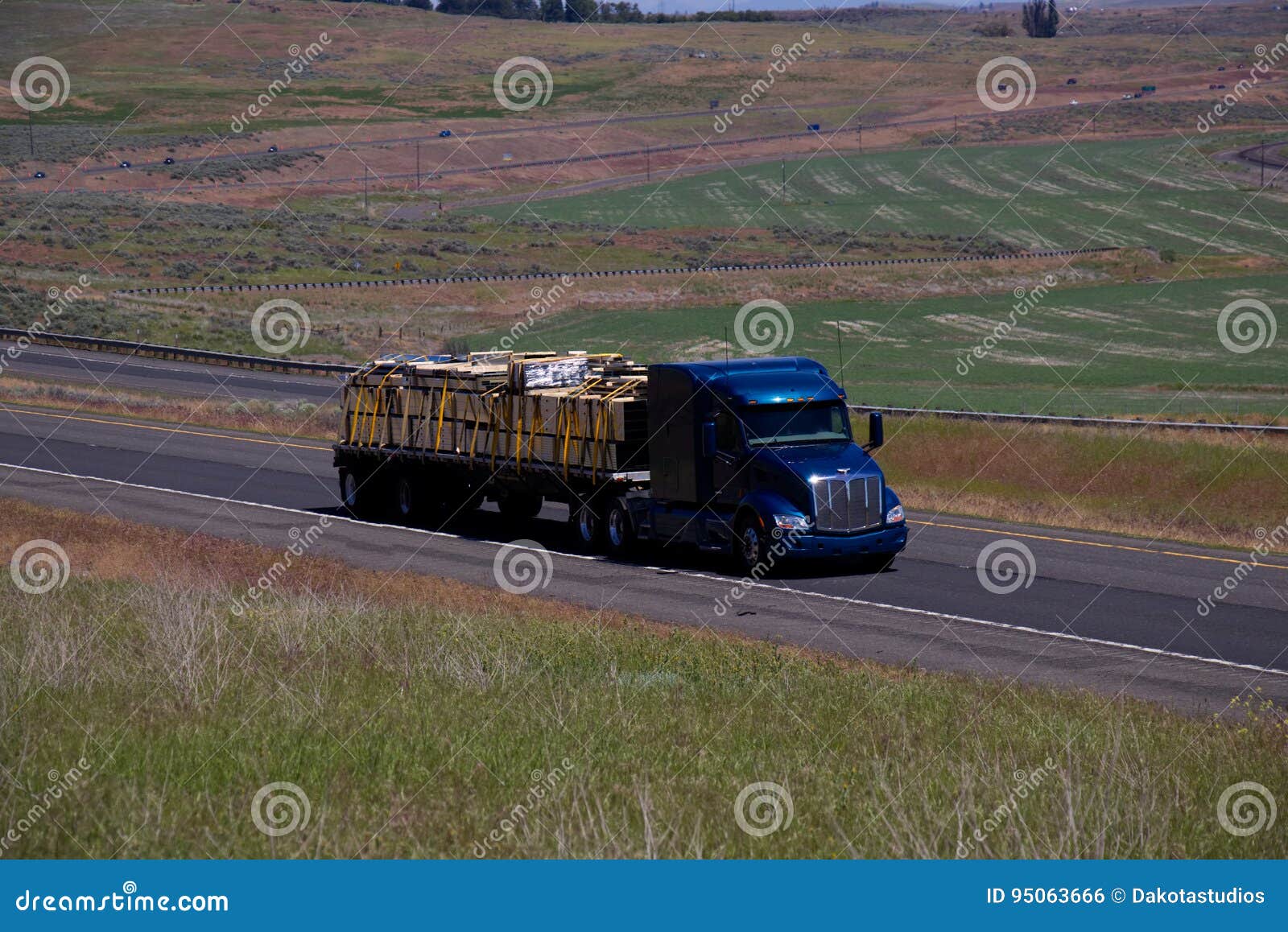 Blue Peterbilt / Loaded Flatbed Stock Photo - Image of tractor, driving ...
