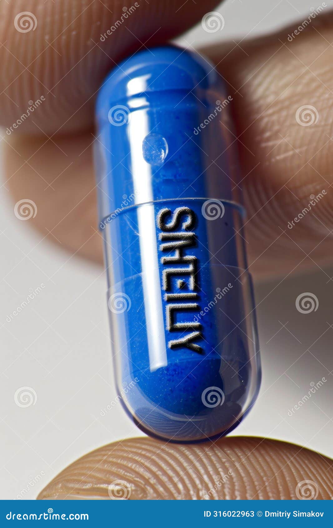 A blue pill with stock image. Image of finger, injection - 316022963