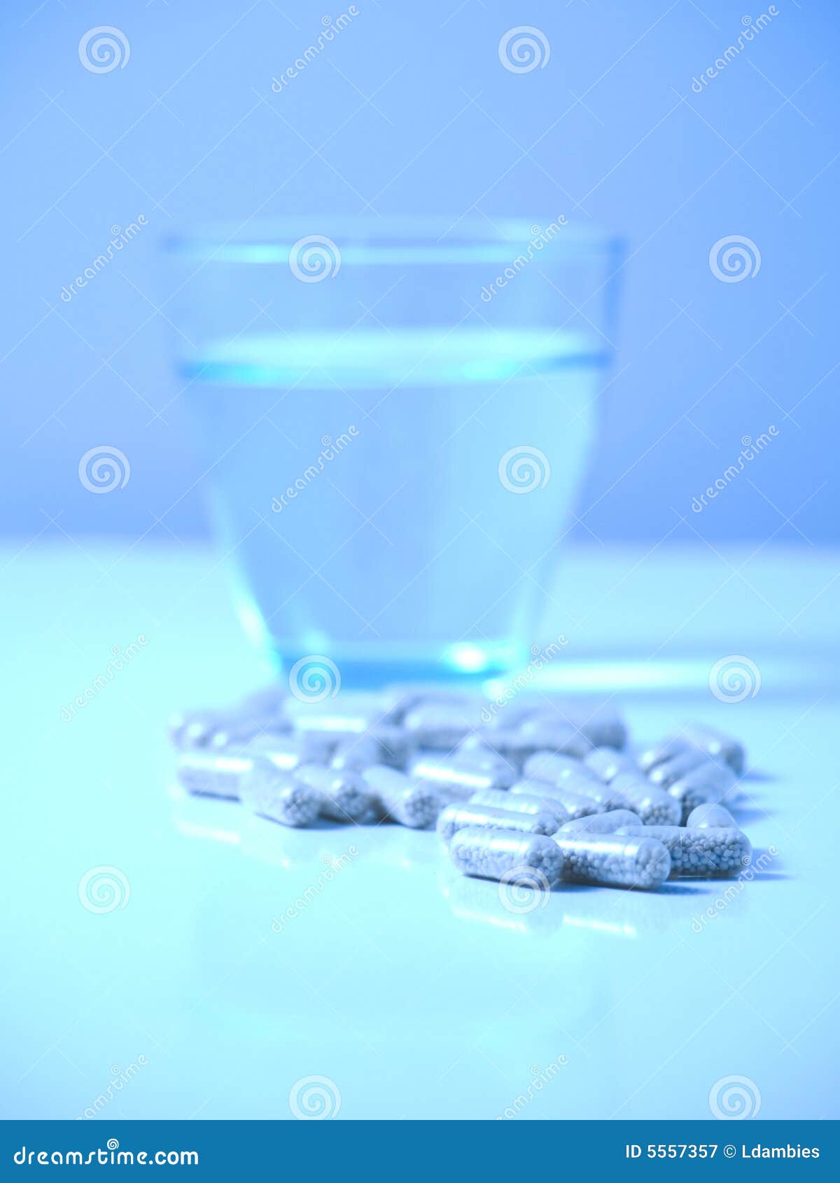 Blue Pills and Glass of Water Stock Image - Image of medicine ...