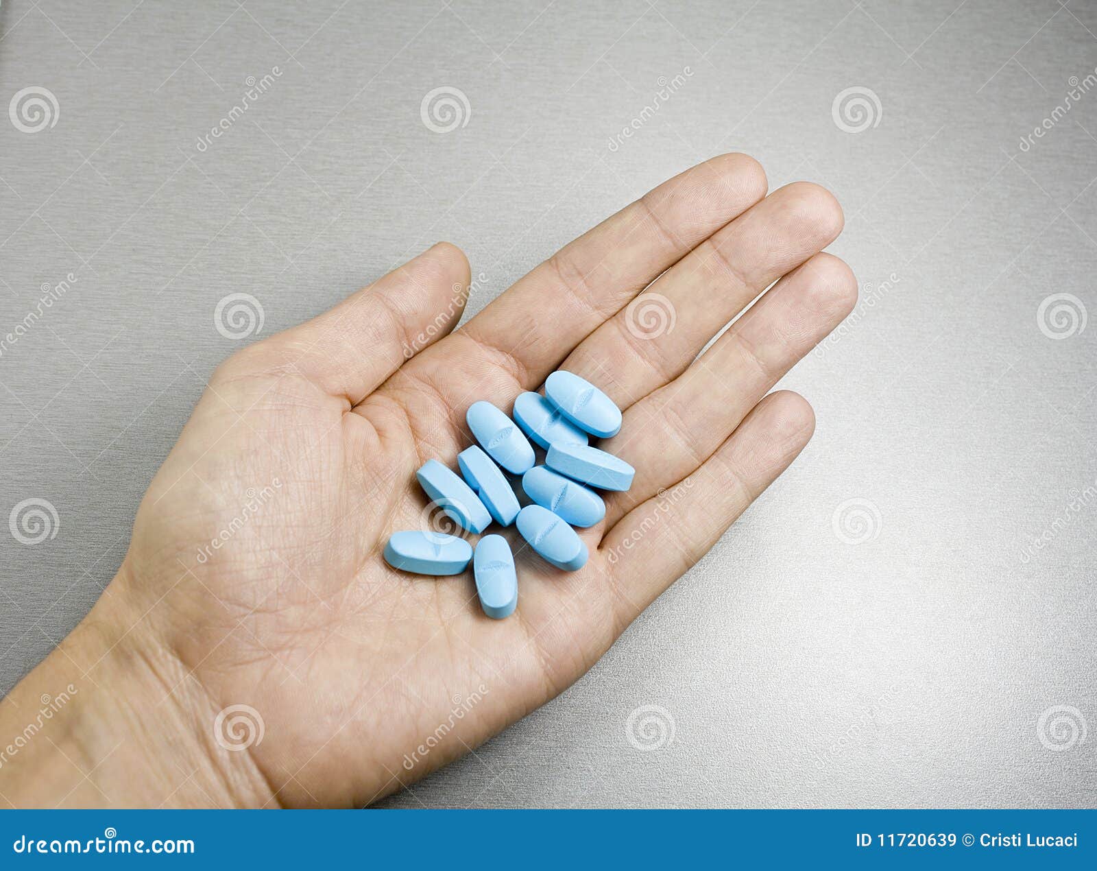 Blue pills in a hand stock image. Image of medicine, medical - 11720639