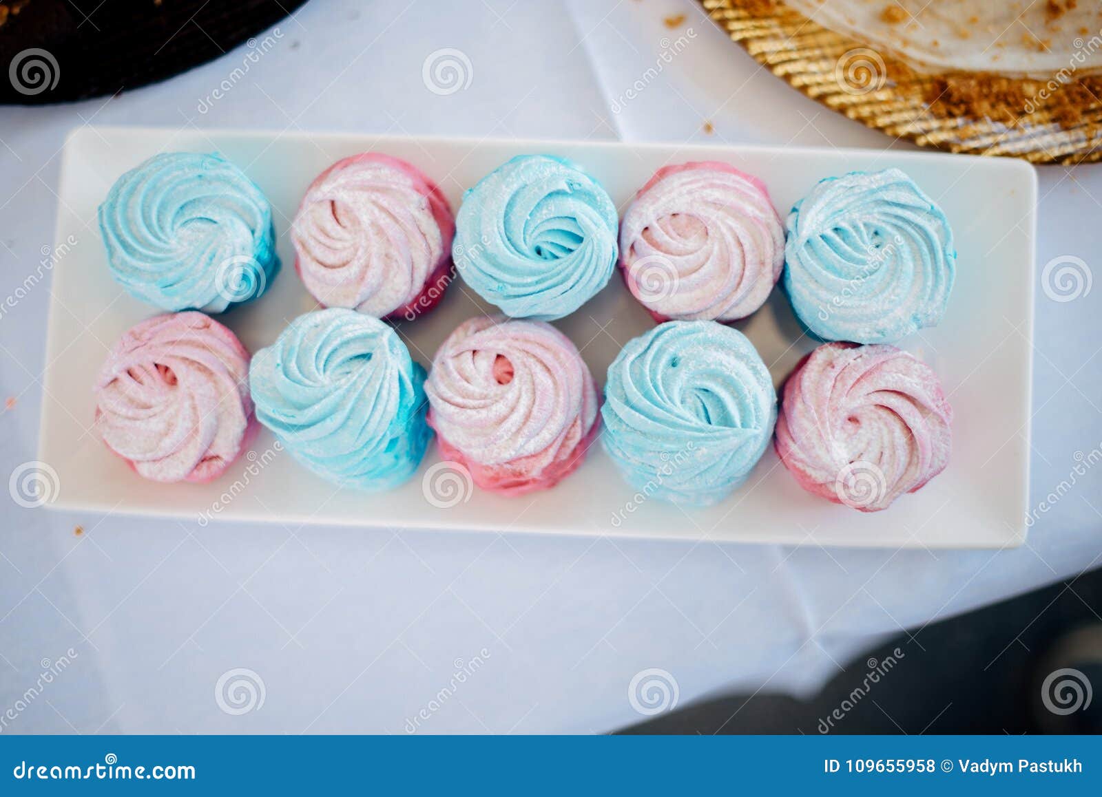 Blue and Pink Cupcakes on a White Plate Stock Photo - Image of macaron ...