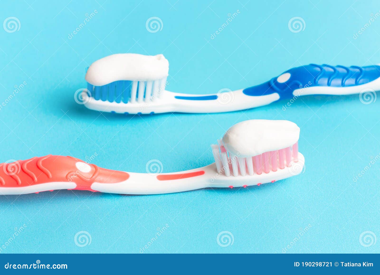 Blue and Pink Toothbrush with Toothpaste on Blue Background Stock Image ...