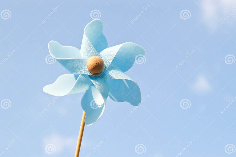 Blue pinwheel stock image. Image of clouds, energy, play - 11070817