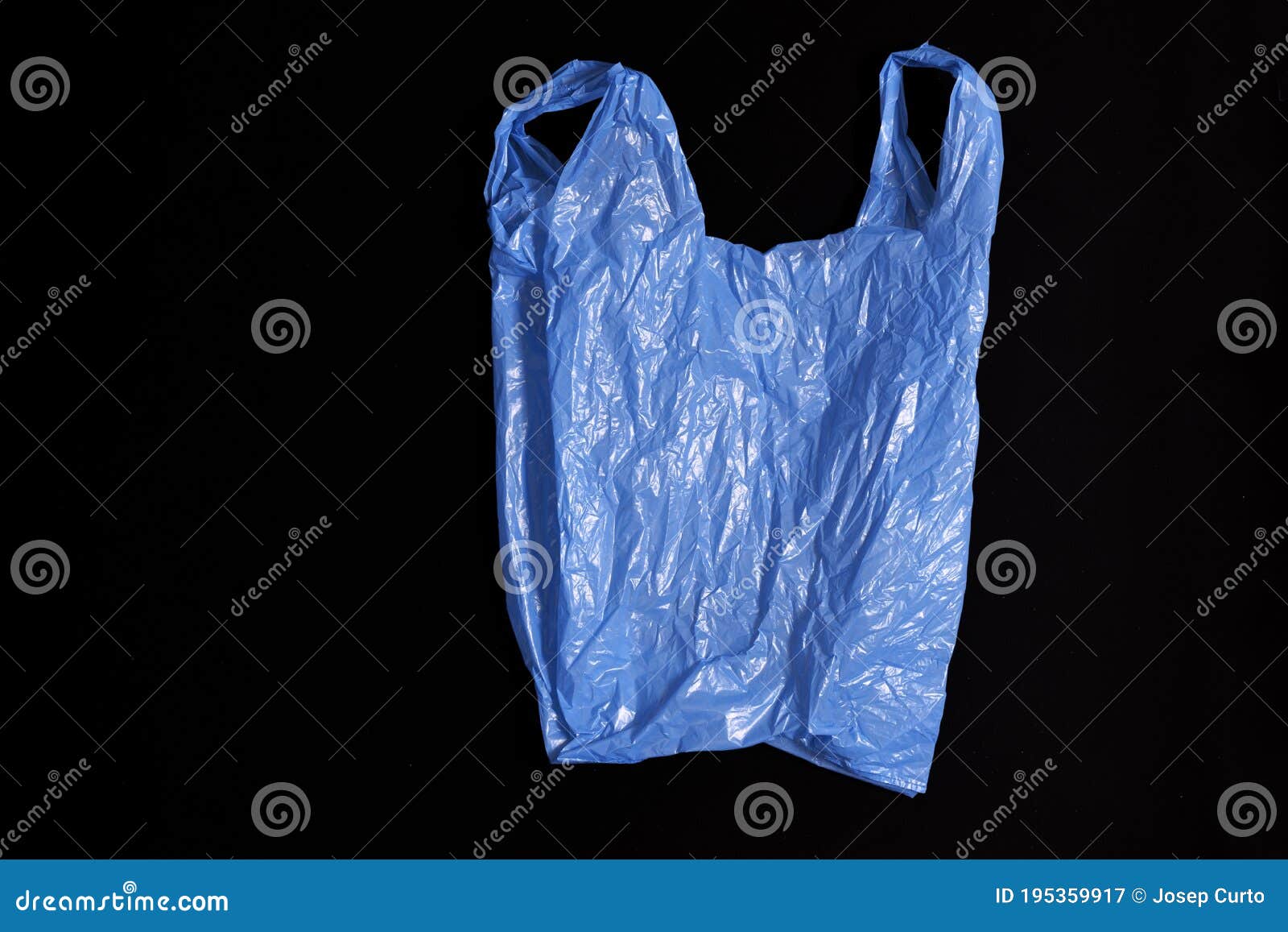 A Blue Plastic Bag on Black Background Stock Image - Image of plastic ...