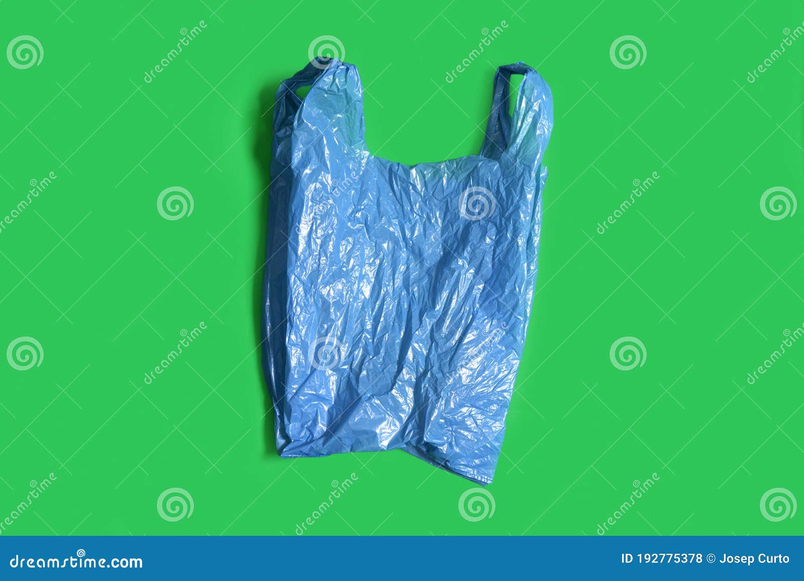 Blue Plastic Bag on Green Background Stock Photo - Image of shopping ...