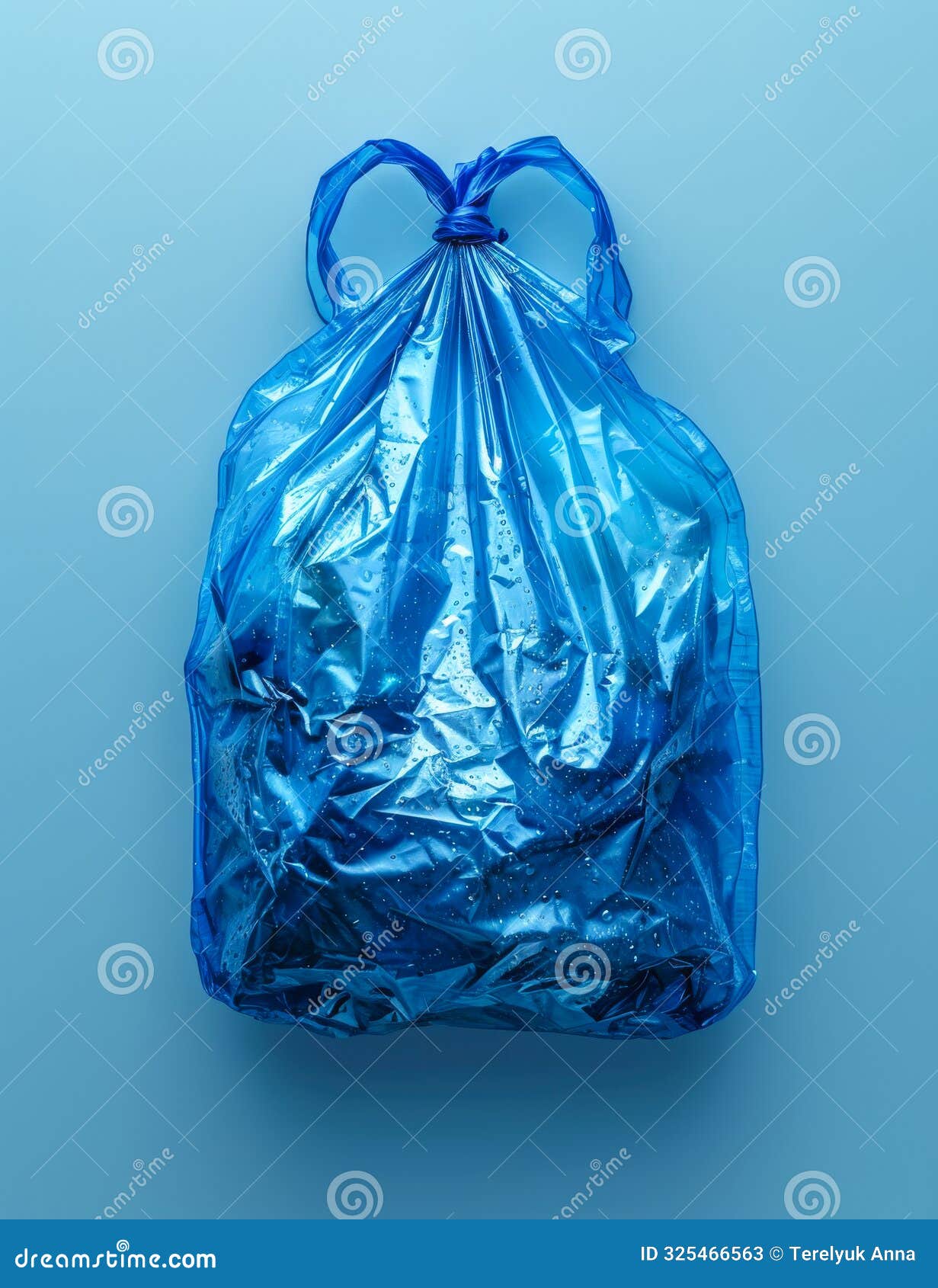 A Blue Plastic Bag with a Silver Handle. the Bag is Open and the Handle ...