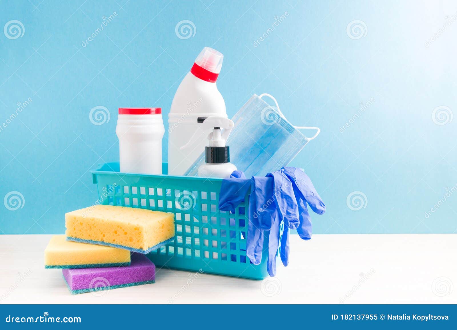 In a Blue Plastic Basket are Different Plastic Bottles with Cleaning ...