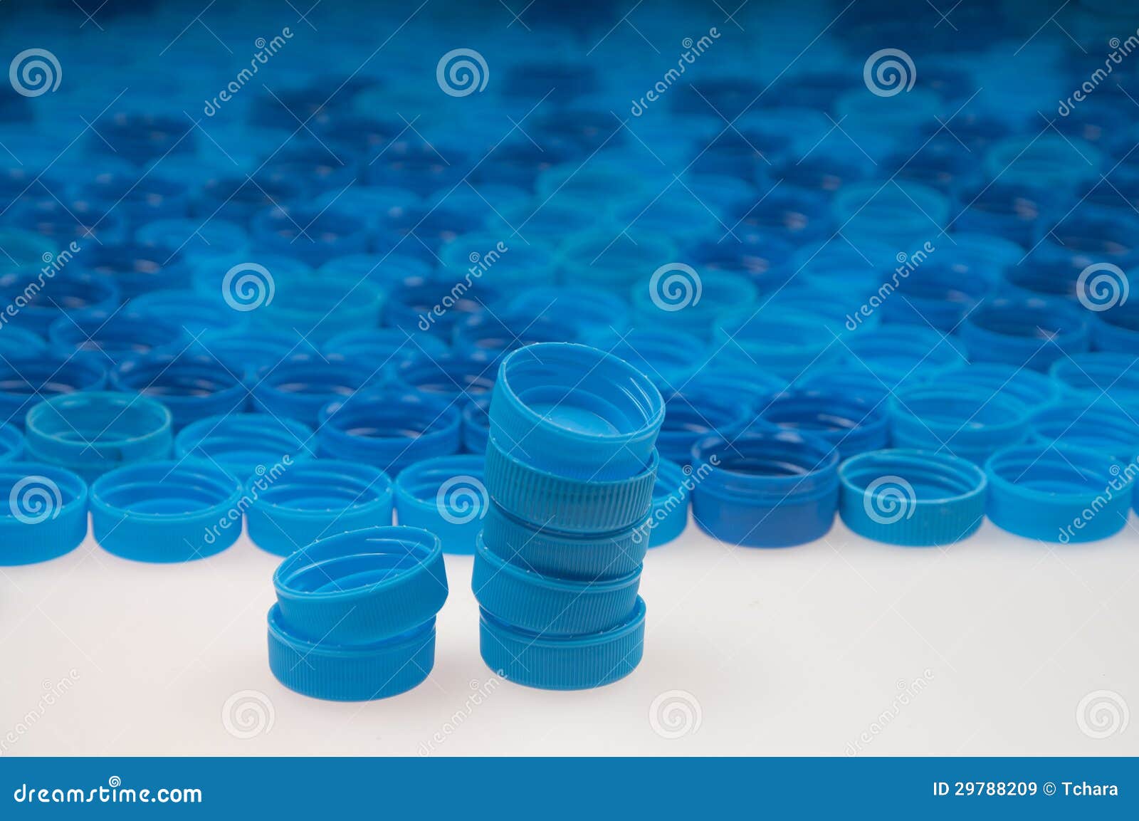 Blue plastic bottle caps stock image. Image of whiite - 29788209