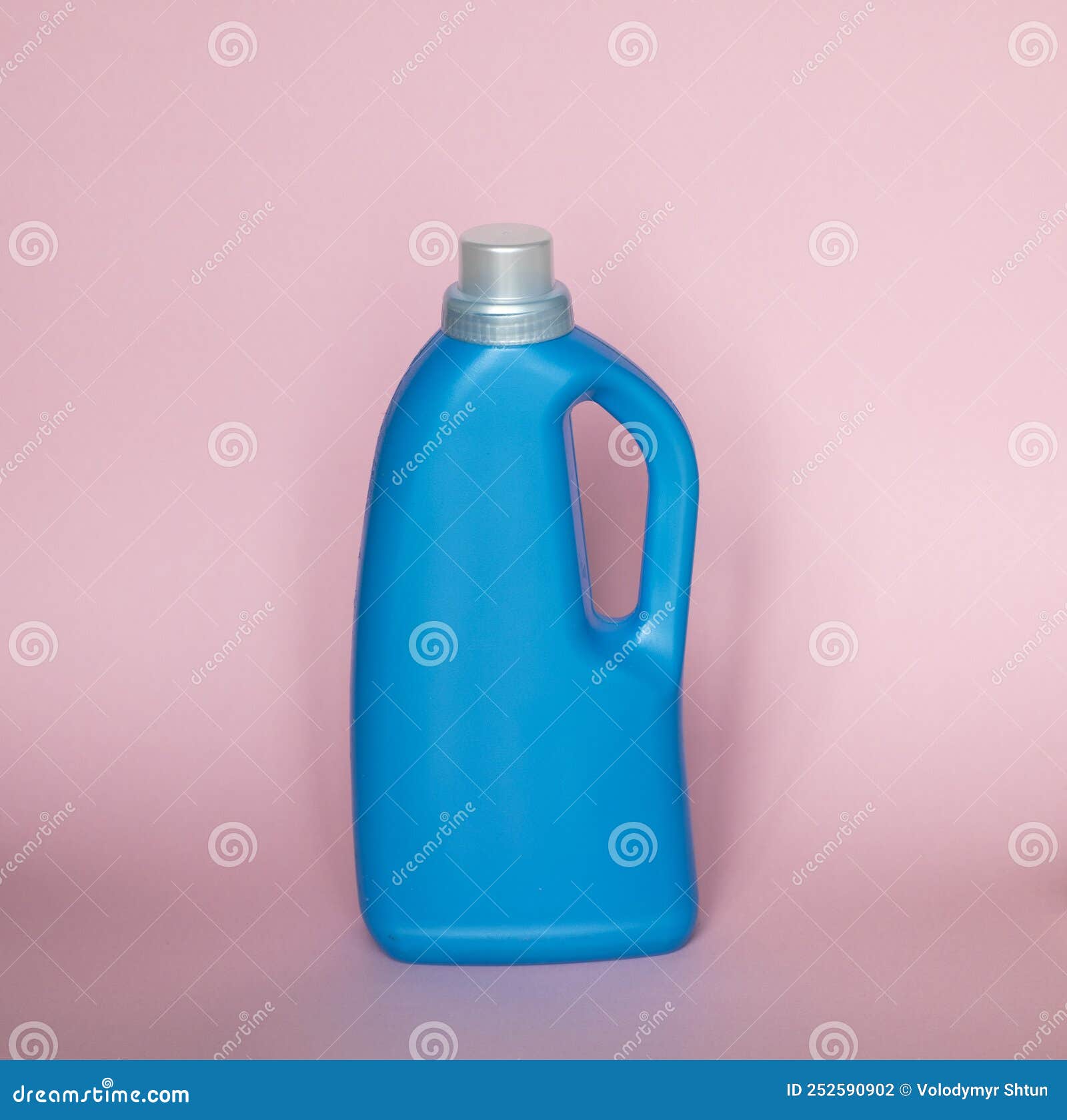 Blue Plastic Bottle with a Grey Cap Isolated on Pink Background for ...