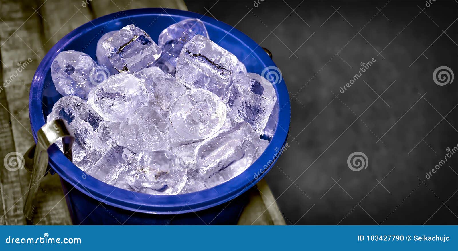 Blue Plastic Bucket Filled with Chunks of Ice with Blurred Background ...