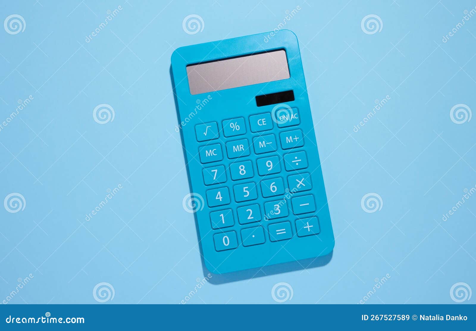 Blue Plastic Calculator on a Blue Background, Top View Stock Image ...